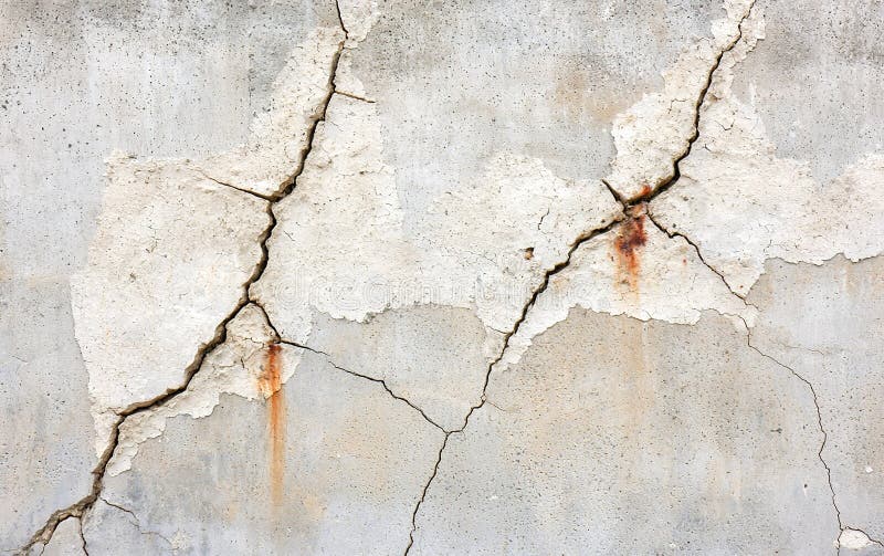 Cracked Concrete Wall with Rust Stains Showing Structural Damage in an ...