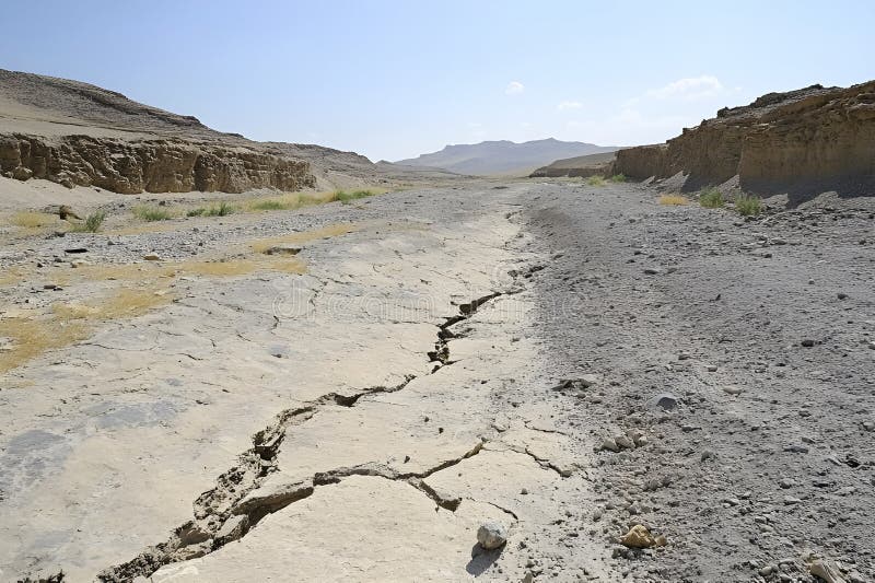 Cracked Dry Riverbed Under a Scorching Sun Stock Photo - Image of crack ...