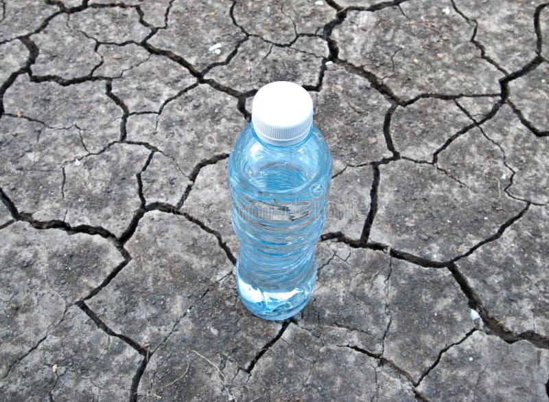 Water bottle on dry ground stock image. Image of environmental - 11228939