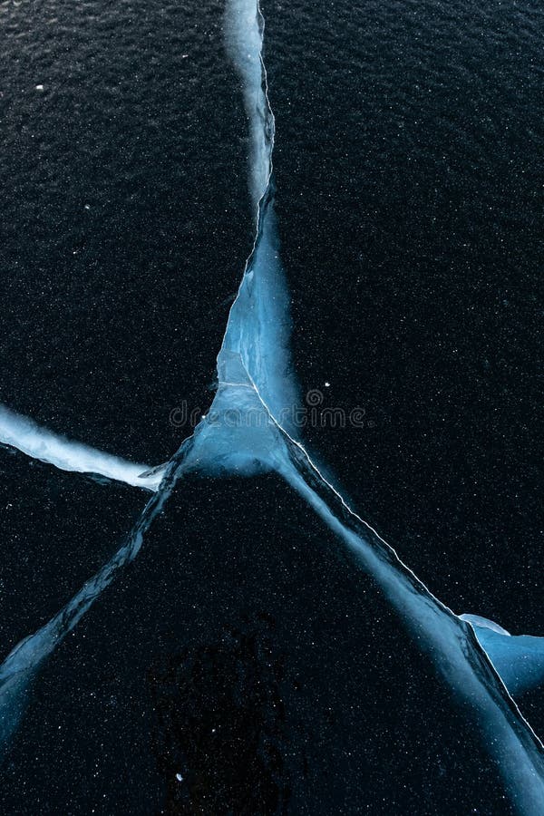 The Cracked Ice Background. Blue Transparent Ice Deep Cracks Top View ...