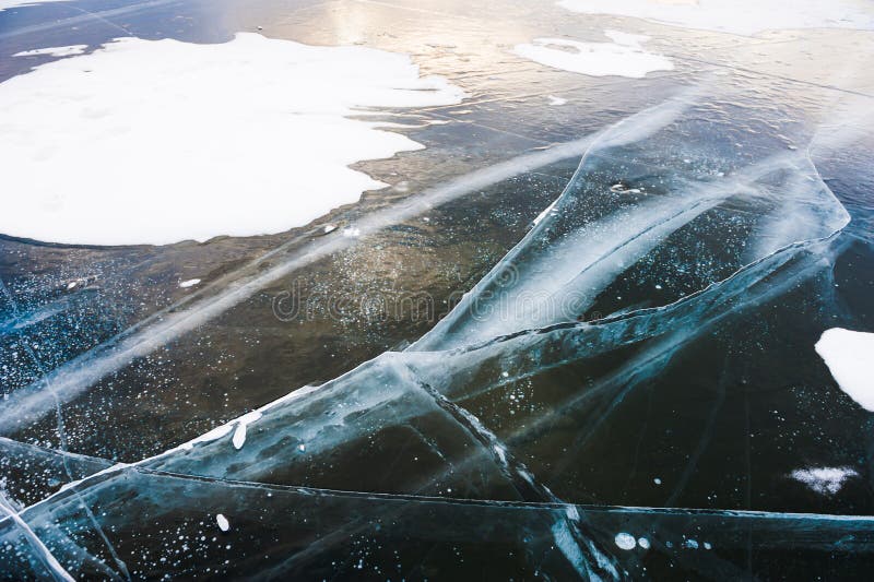 Cracked ice on the lake. stock photo. Image of lake, clear - 67303056