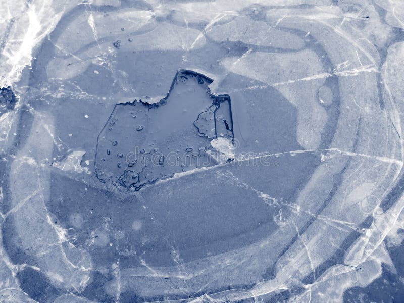 Cracked ice in a puddle. stock image. Image of weather - 237506217