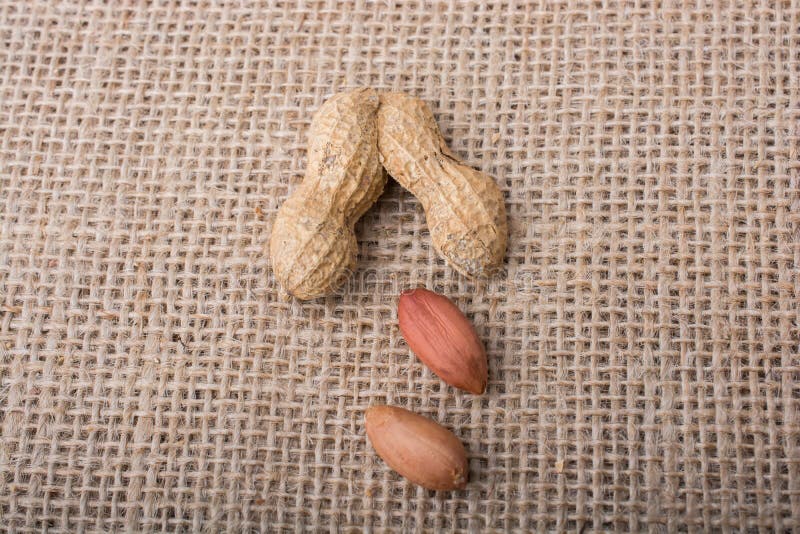 Cracked Open Peanuts with Shell on a Linen Canvas Stock Photo - Image ...
