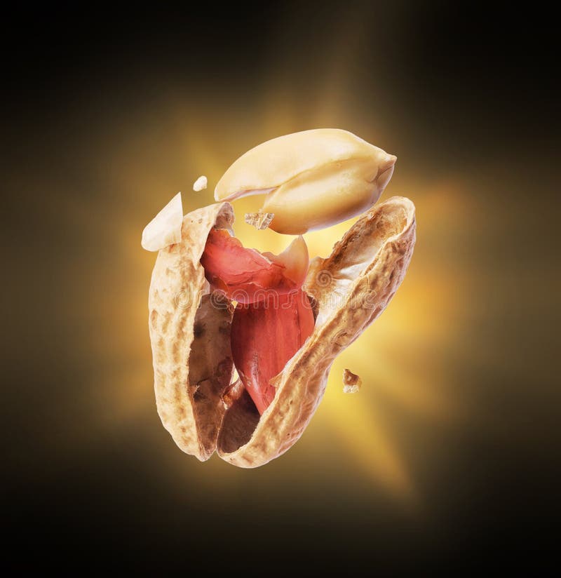 A Cracked Peanut with a Flash of Light in the Dark Stock Photo - Image ...
