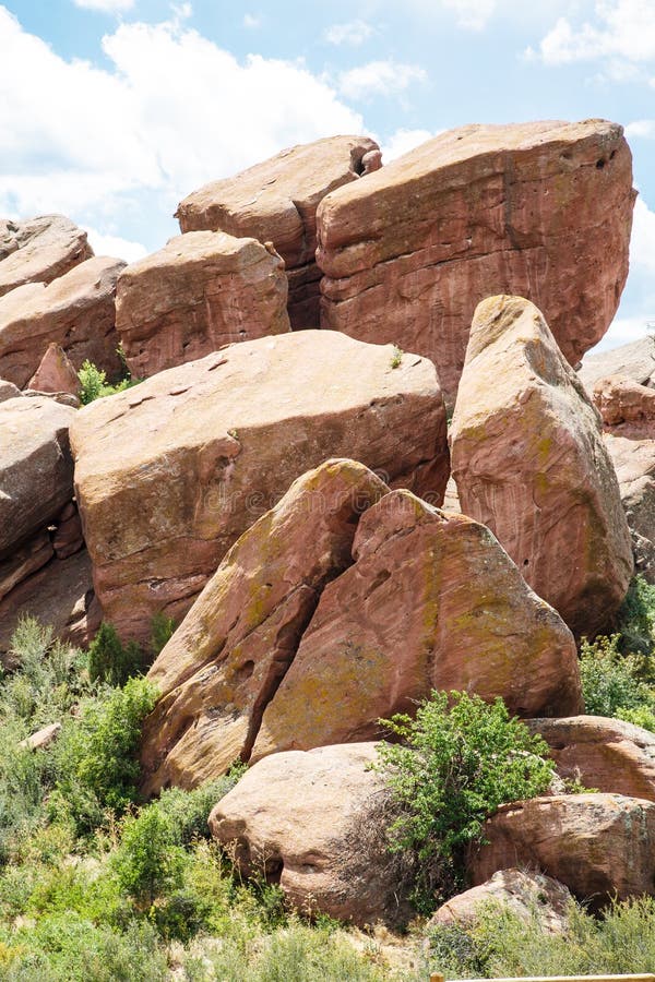 Huge Red Boulder Under Cloudy Sky Stock Image - Image of rocky, desert ...