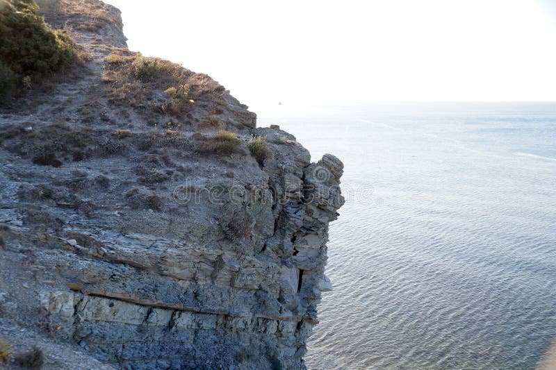 A Cracked Rock on a Cliff by the Sea Stock Photo - Image of rocks ...