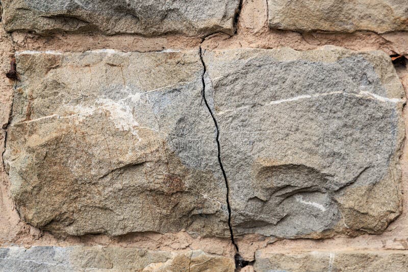 Cracked Stone Wall Showing Natural Texture and Weathering Patterns ...
