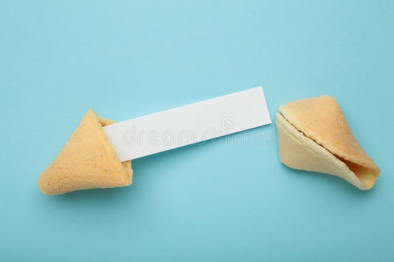 Cracked Traditional Fortune Cookie with Prediction on Blue Background ...