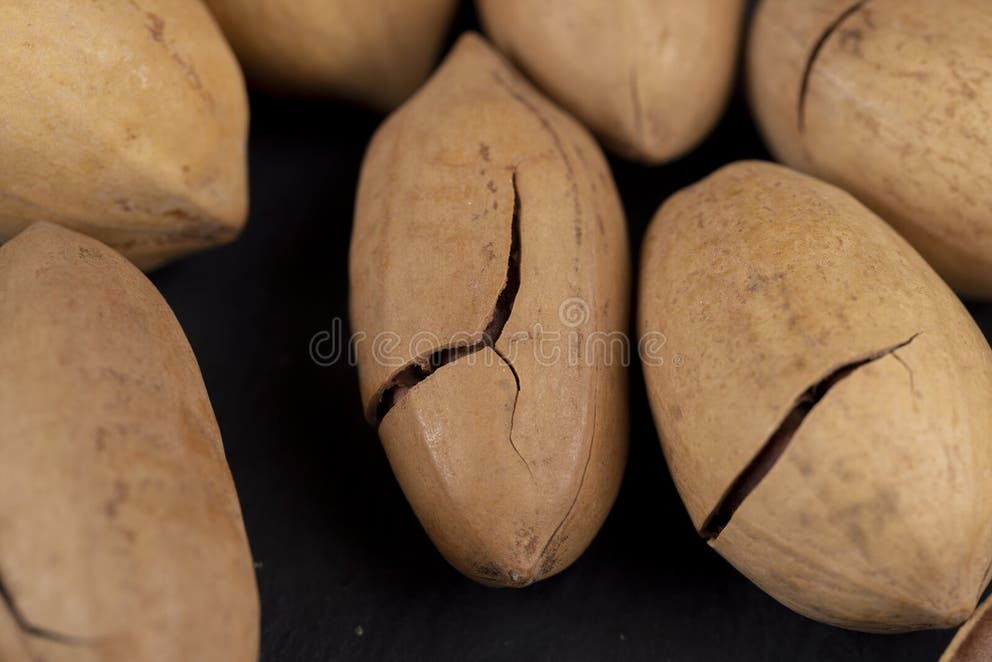 Cracked Unpeeled Pecans Close-up on the Table Stock Photo - Image of ...