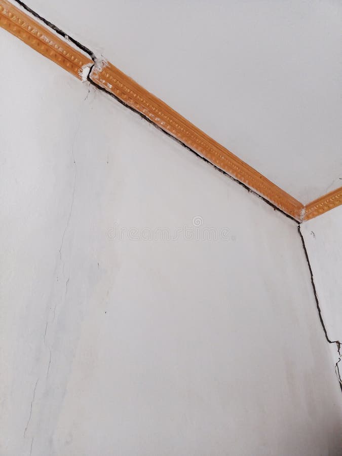 Cracked Wall Corner with Dirty Stains and Ceiling Molding Trim. Stock ...