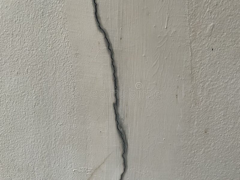 Cracked Wall Surface Showing Vertical Fissure in Paint and Texture ...