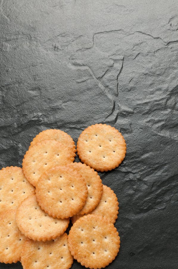 Crackers on black granite stock image. Image of black - 78496039