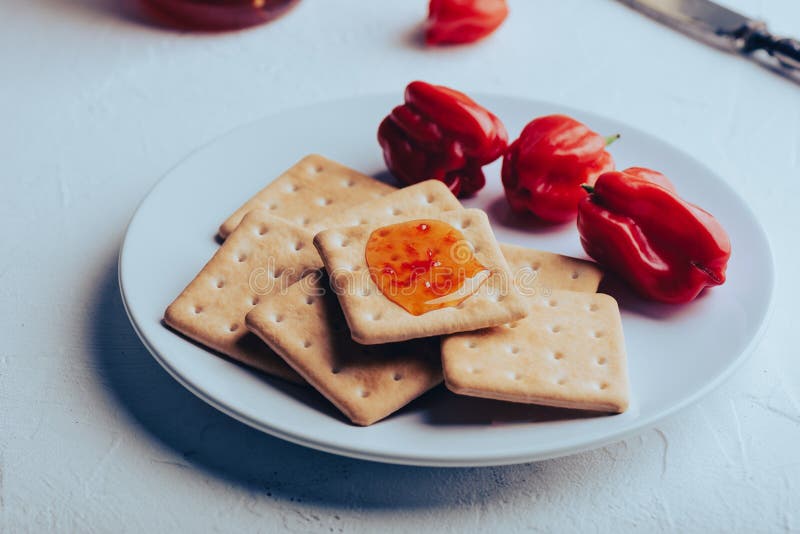 Crackers with Chili Pepper Jelly Stock Photo - Image of wheat, sauce ...