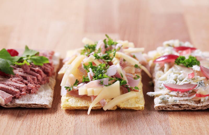 Crackers with Different Toppings Stock Photo - Image of variety, blue ...