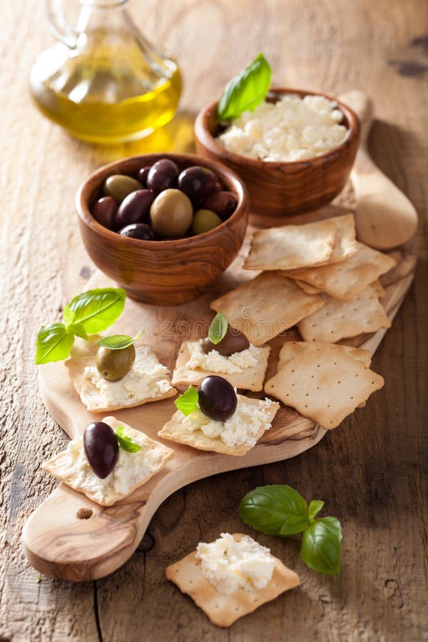 Crackers with Soft Cheese and Olives. Healthy Appetizer Stock Photo ...