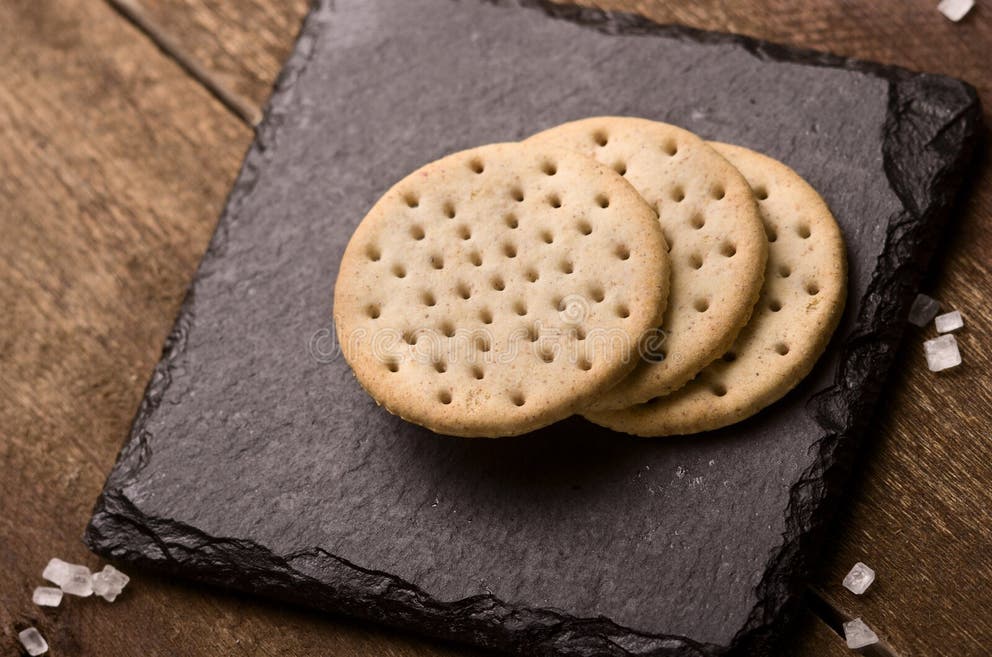 Crackers Stack Together on Black Stone, Coarse Sugar on Wooden B Stock ...