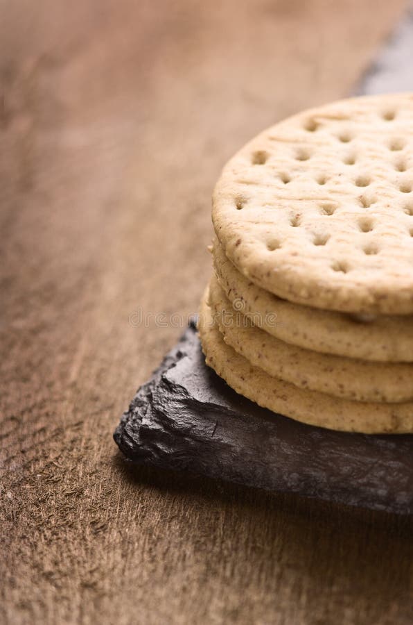 Crackers Stack Together on Black Stone, Wooden Background.Copy S Stock ...