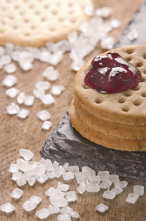 Crackers Stack Together with Jam on Top on Black Stone, Coarse S Stock ...