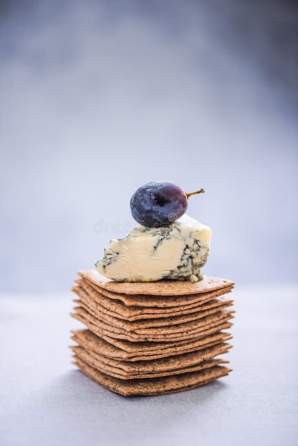 Crackers Stack Topped with Brie Cheese and Grape Stock Image - Image of ...