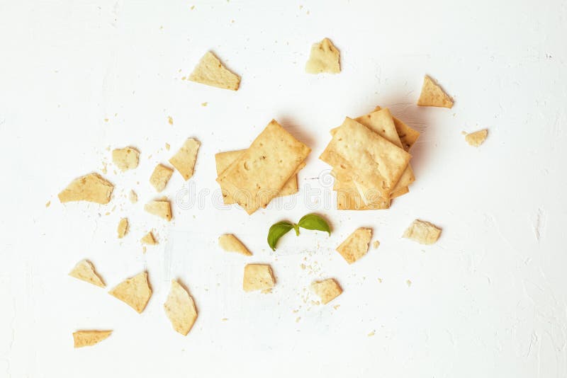 Crackers on a White Table with Basil Leaves. Stock Photo - Image of ...