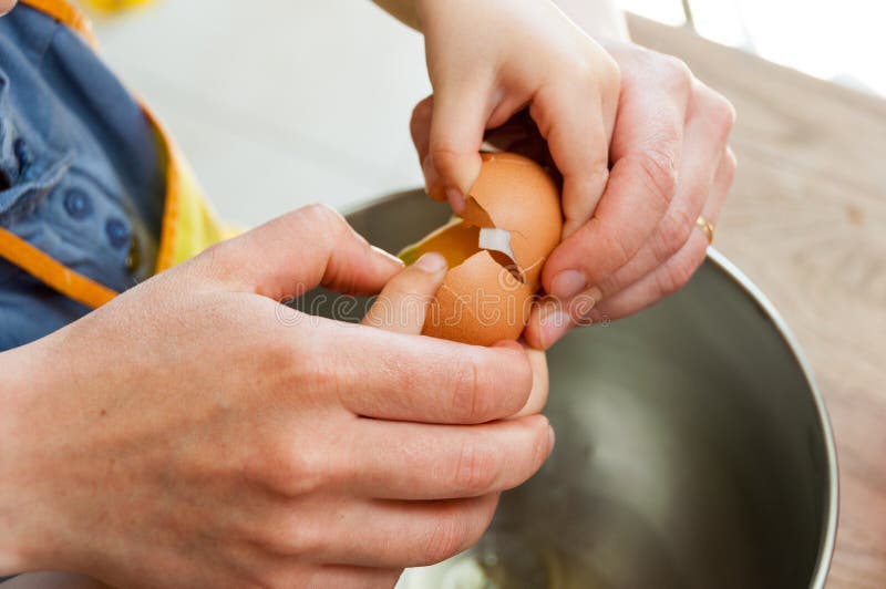 Cracking an egg stock photo. Image of recipe, eggshell - 41623524