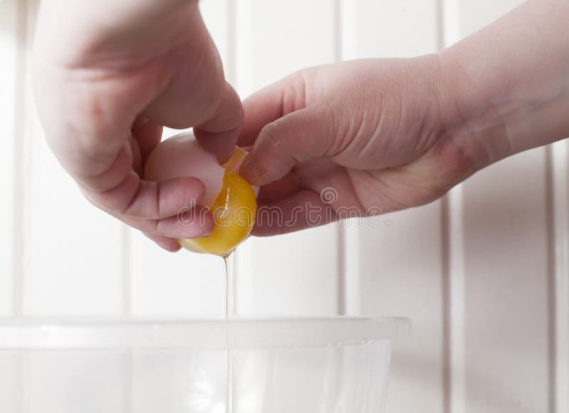 Cracking an Egg stock image. Image of diet, life, closeup - 98759149