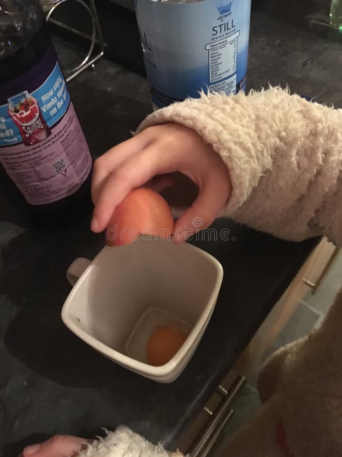 Cracking an egg editorial stock photo. Image of baking - 160981553