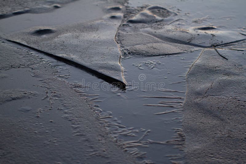 Cracking Ice on Water Pond in the Beginning of Spring Stock Photo ...