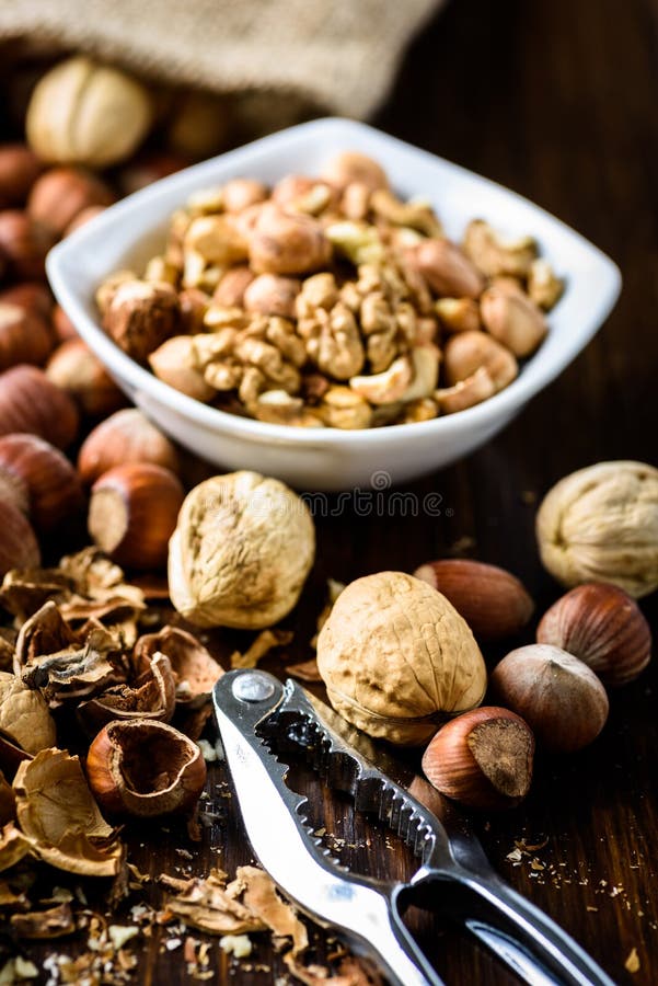 Cracking Nuts and Nutcracker Stock Photo - Image of nutrition, fruit ...