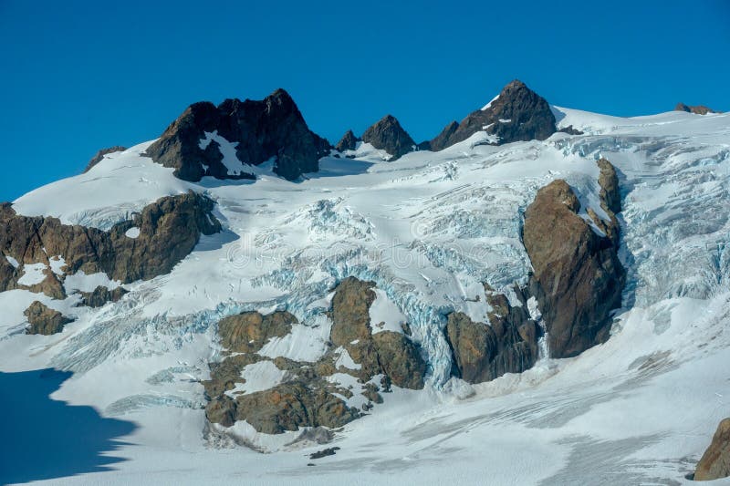 Cracking Surface of Snow and Ice on Blue Glacier in Olympic Stock Photo ...
