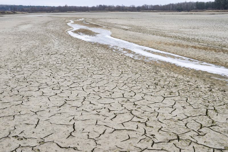 Cracks in the Channel of the Dried-up River Covered with Ice in the ...