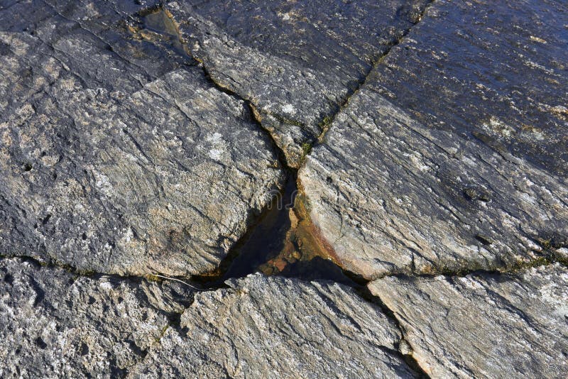 Cracks Forming Triangle on Bedrock Stock Photo - Image of form ...