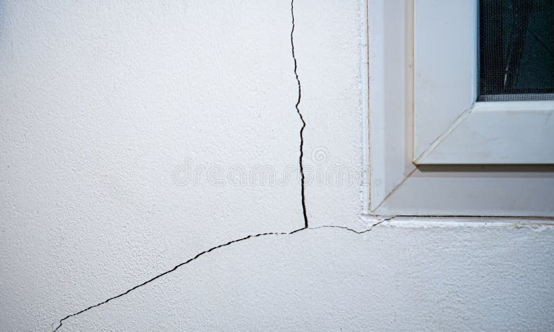 Cracks on the Wall. the Crack in the Cement Wall at the Window Sill ...