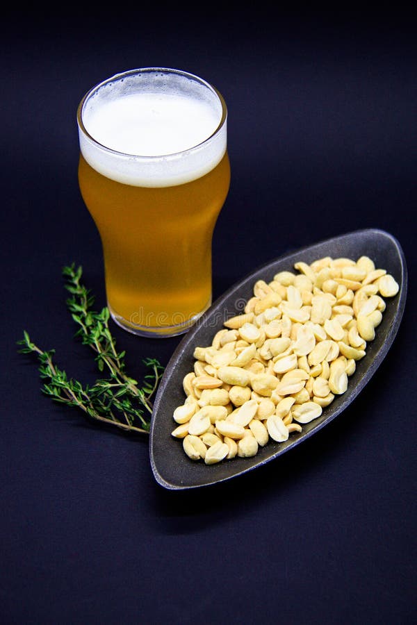 Craft Beer and Peanuts on Black Background Stock Photo - Image of dark ...