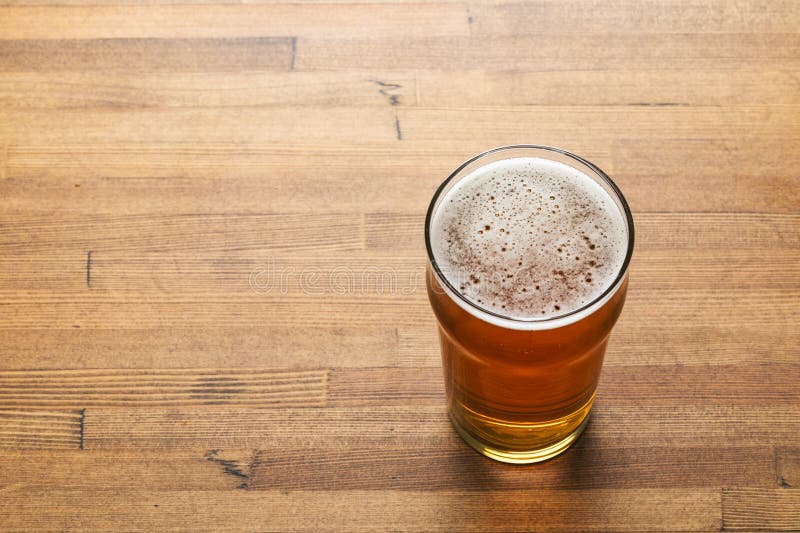 Craft Beer in Pint Glass on a Wooden Table Stock Photo - Image of pint ...