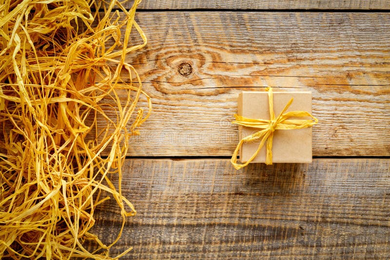 Craft Gift Box on Wooden Table with Raffia or Twine Stock Image - Image ...