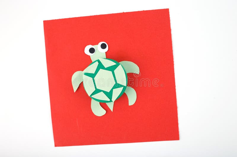 A Craft Made from Plastic Cap and Paper Materials. the Turtle Has a ...