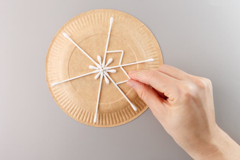 A Craft Project Involving a Paper Plate and Cotton Swabs. DIY Geometric ...