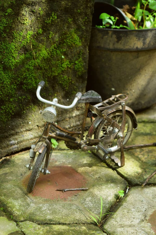 Craft a Toy Bicycle Model with a Green Garden Background Stock Image ...