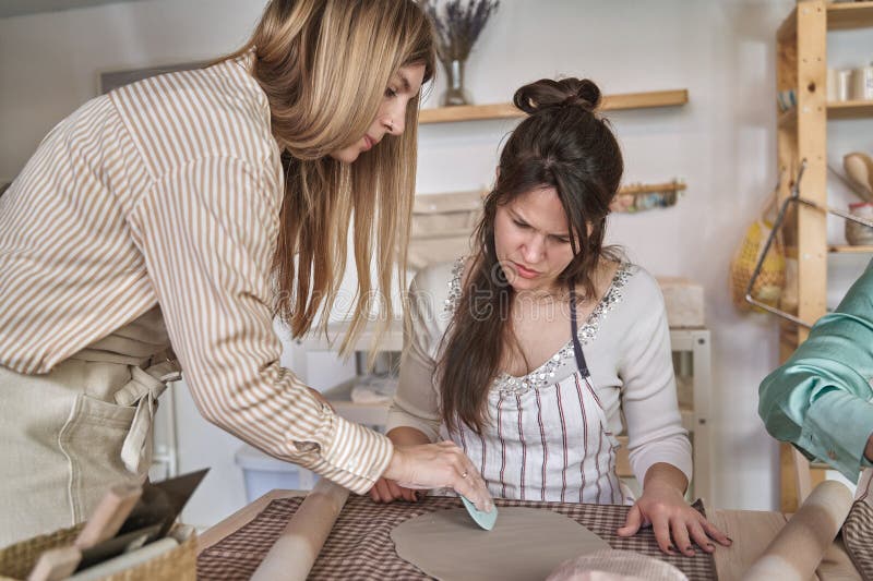 Craft Woman Helping Her Student in a Ceramic Workshop. Stock Image ...