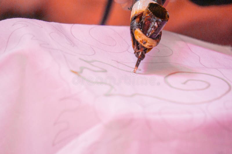 Crafter is Making Batik Patterns on Fabric Using a Tool Called a ...