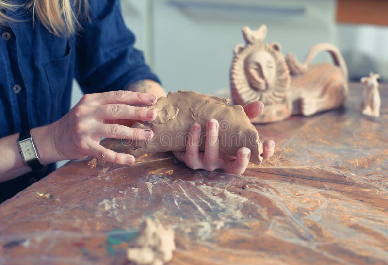 Crafting Clay Sculptures in a Workshop with Intricate Designs and Tools ...