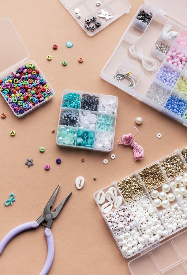 Crafting with Colorful Beads on a Flat Workspace with Tools and ...