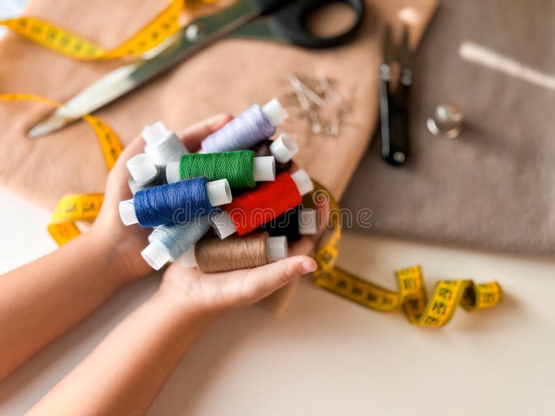 Crafting Essentials. Hands Holding Colorful Spools of Thread with ...