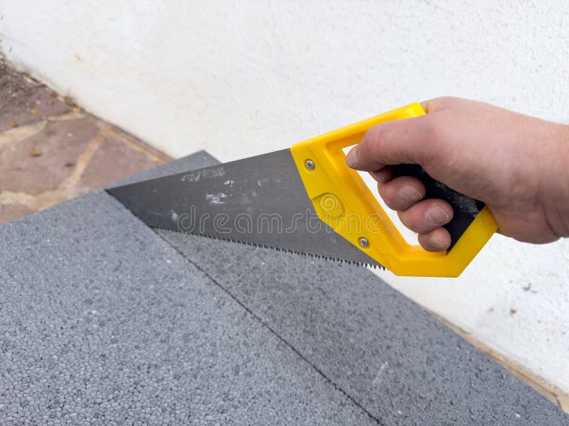 Crafting a Masterpiece with Precision Using a Handsaw on Textured ...