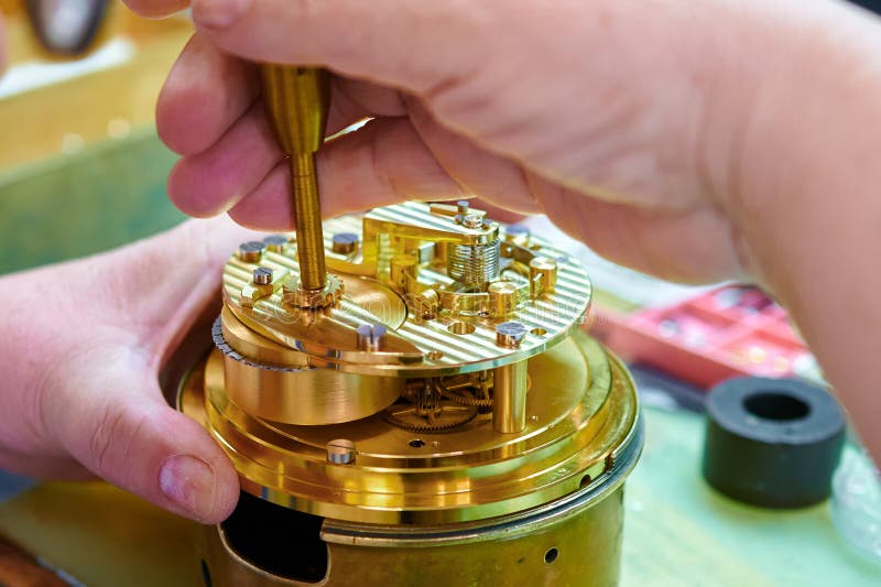 Crafting Precision As a Man Skillfully Repairs a Vintage Watch in a ...
