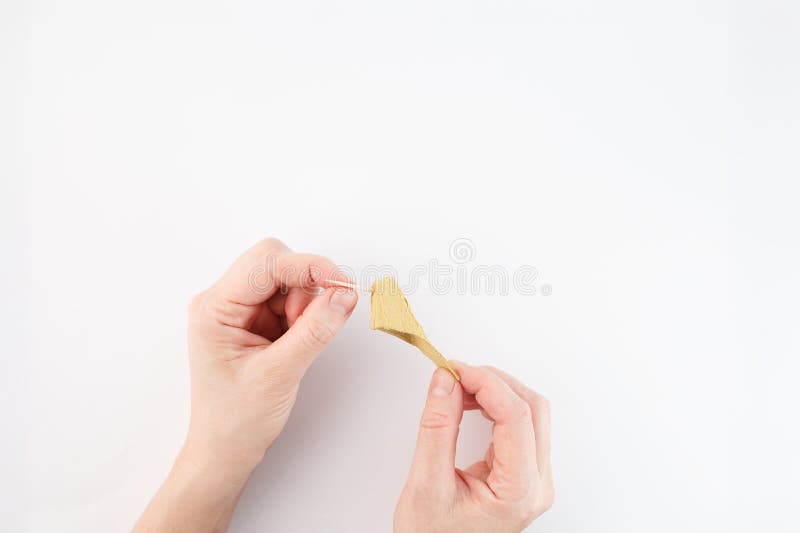 Crafting with Recycled Materials, Hand Holding Toothpick in Egg Carton ... Crafting with Recycled Materials, Hand Holding Toothpick in Egg Carton ...