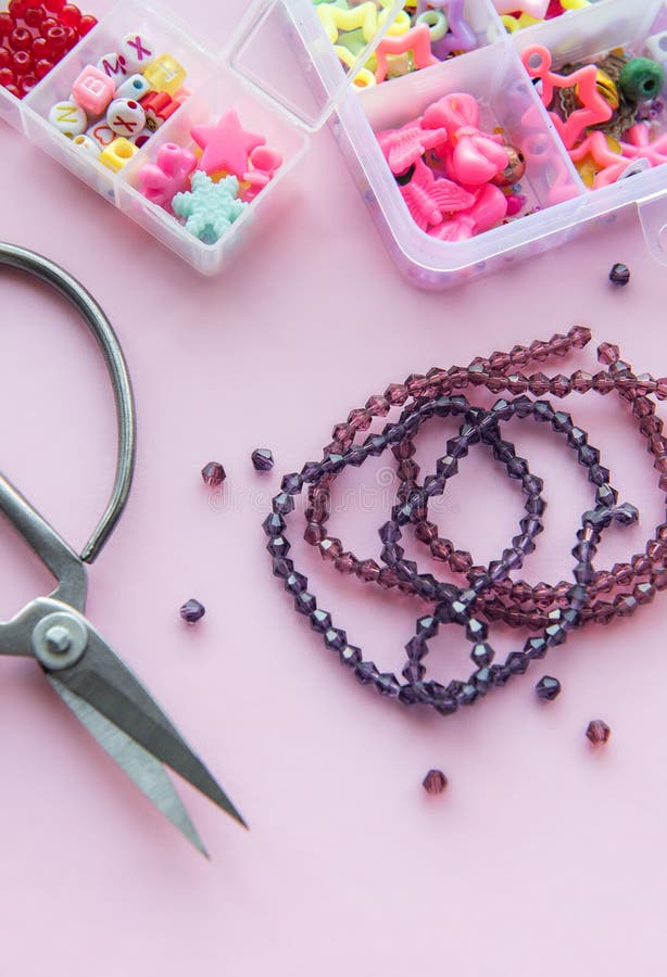 Crafting Supplies Spread Out on a Pink Surface Featuring Beads ...
