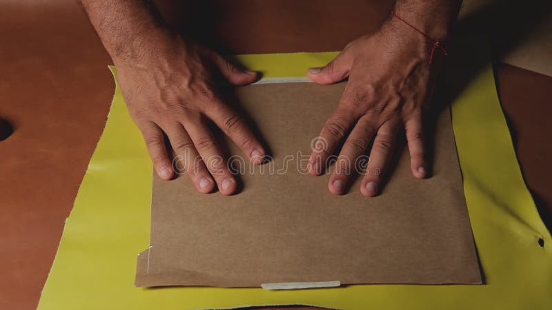 Leather Artisan Gluing Paper Template on Yellow Leather Stock Video ...