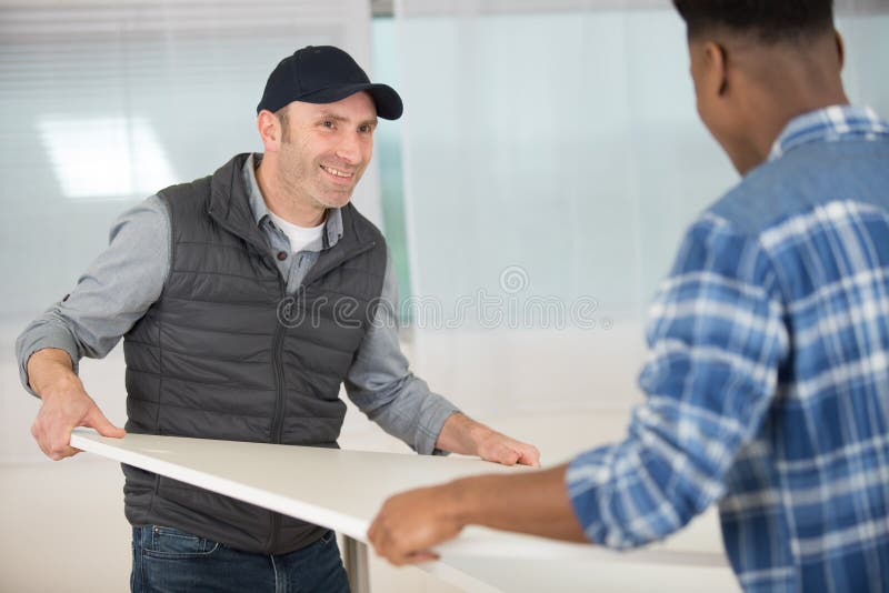 Craftsman and Apprentice Work Together in Workshop Stock Image - Image ...